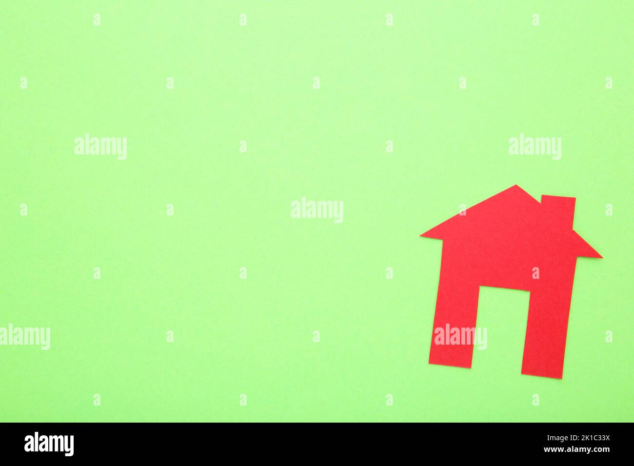 Red paper house on lime background, top view Stock Photo - Alamy