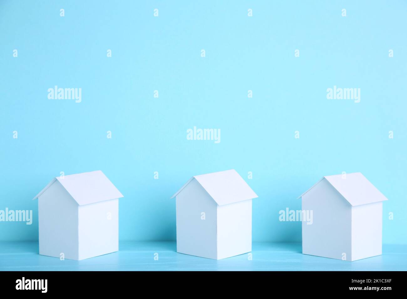 Paper town. Papercraft house and papercraft building on blue background ...