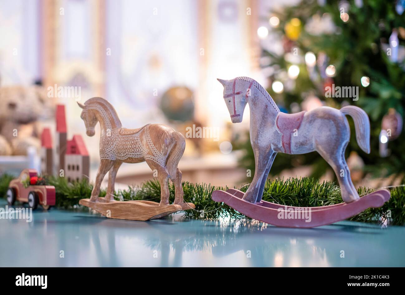 Christmas composition of wooden horses on the background of the side ...