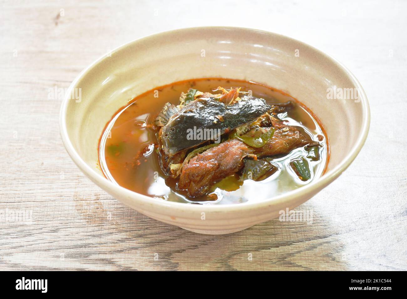 boiled smoked dry snake head fish in spicy and sour soup on bowl Stock ...