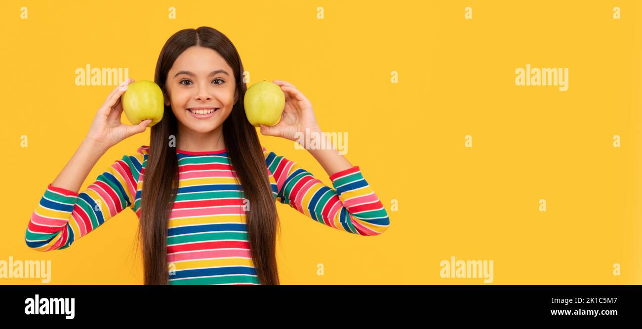 Say hello to a nice smile. Happy child smile holding apples. Child girl ...