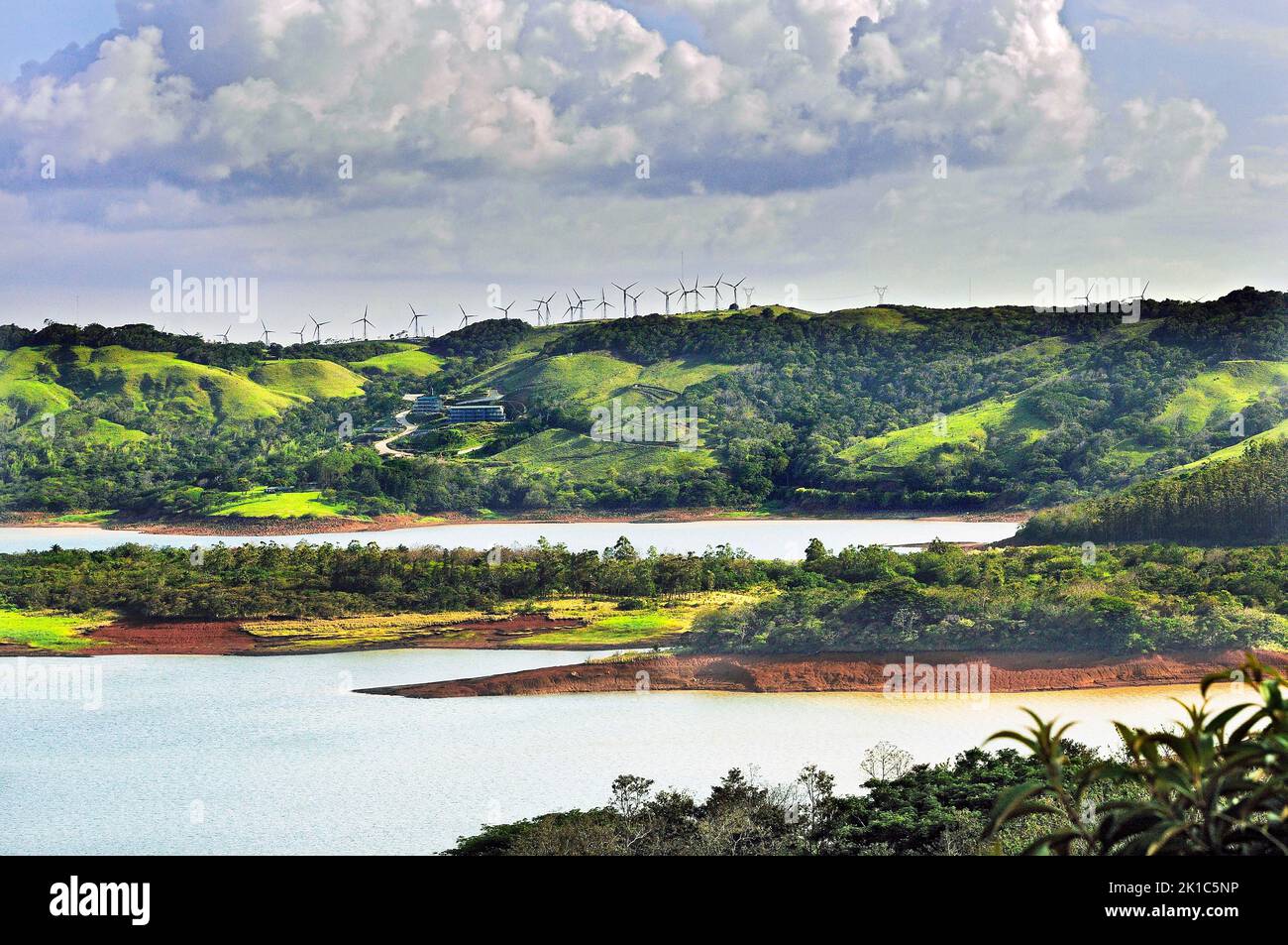 West shore of Lake Arenal with new hotel and wind turbines, Alajuela ...