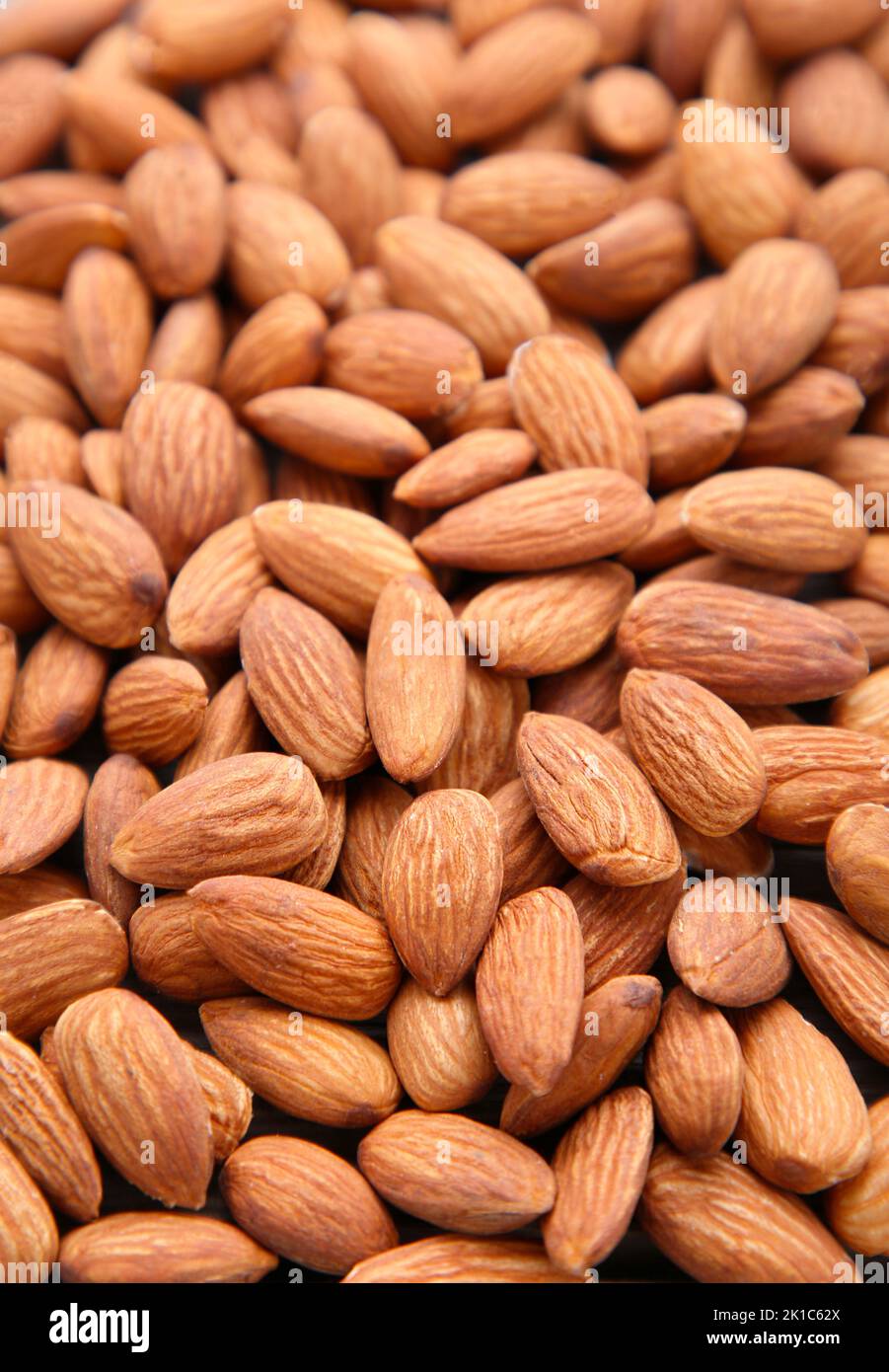 Organic almond nuts as background, top view Stock Photo - Alamy