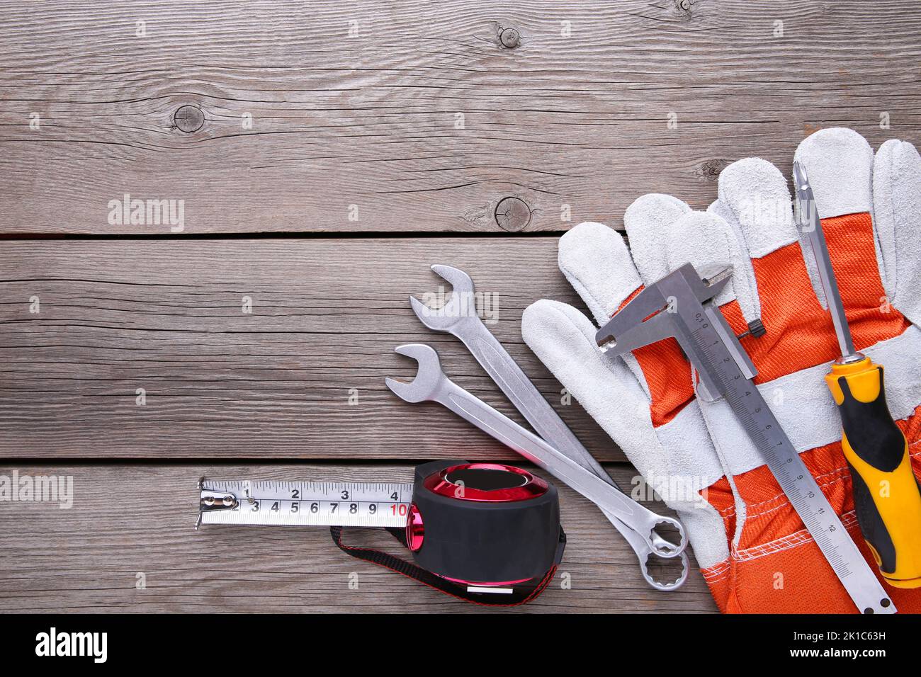Different construction tools on wooden background with copy space Stock ...