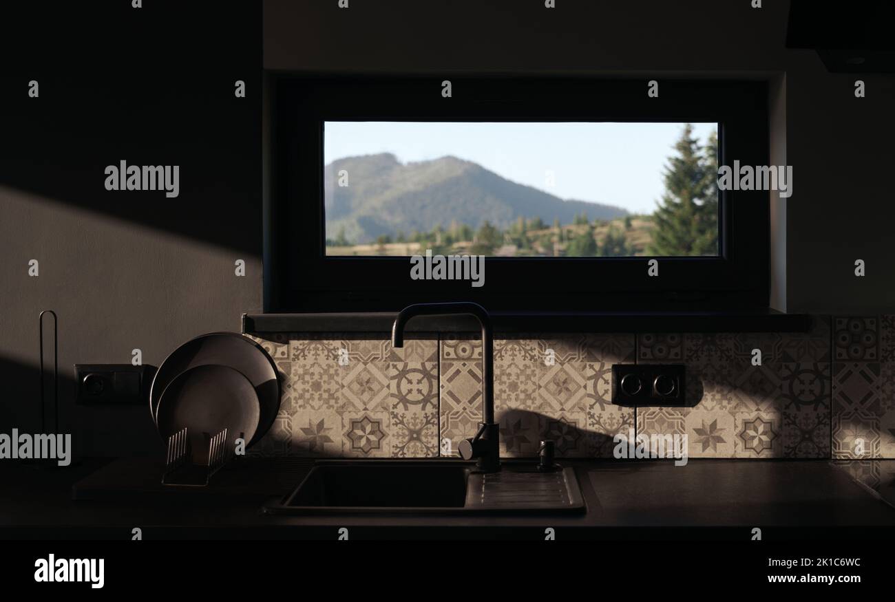 Counter top of modern kitchen with patch work tiles and moun view from ...