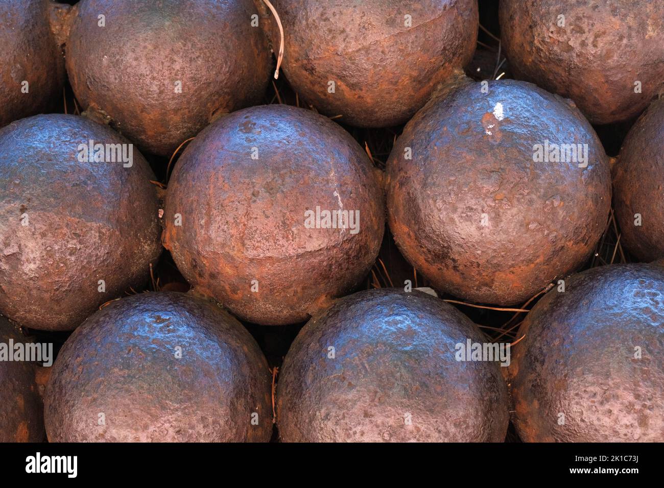 Closeup of ancient and rusty cannon balls, pattern, iron sphere shape ...
