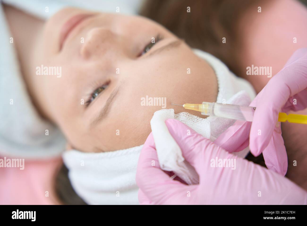 Beautician makes injection for acne treatment to girl in clinic Stock ...