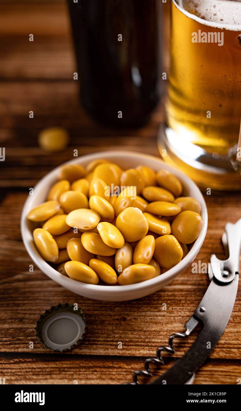 Close-up of salted Lupin Beans with beer on table with copy space Stock ...
