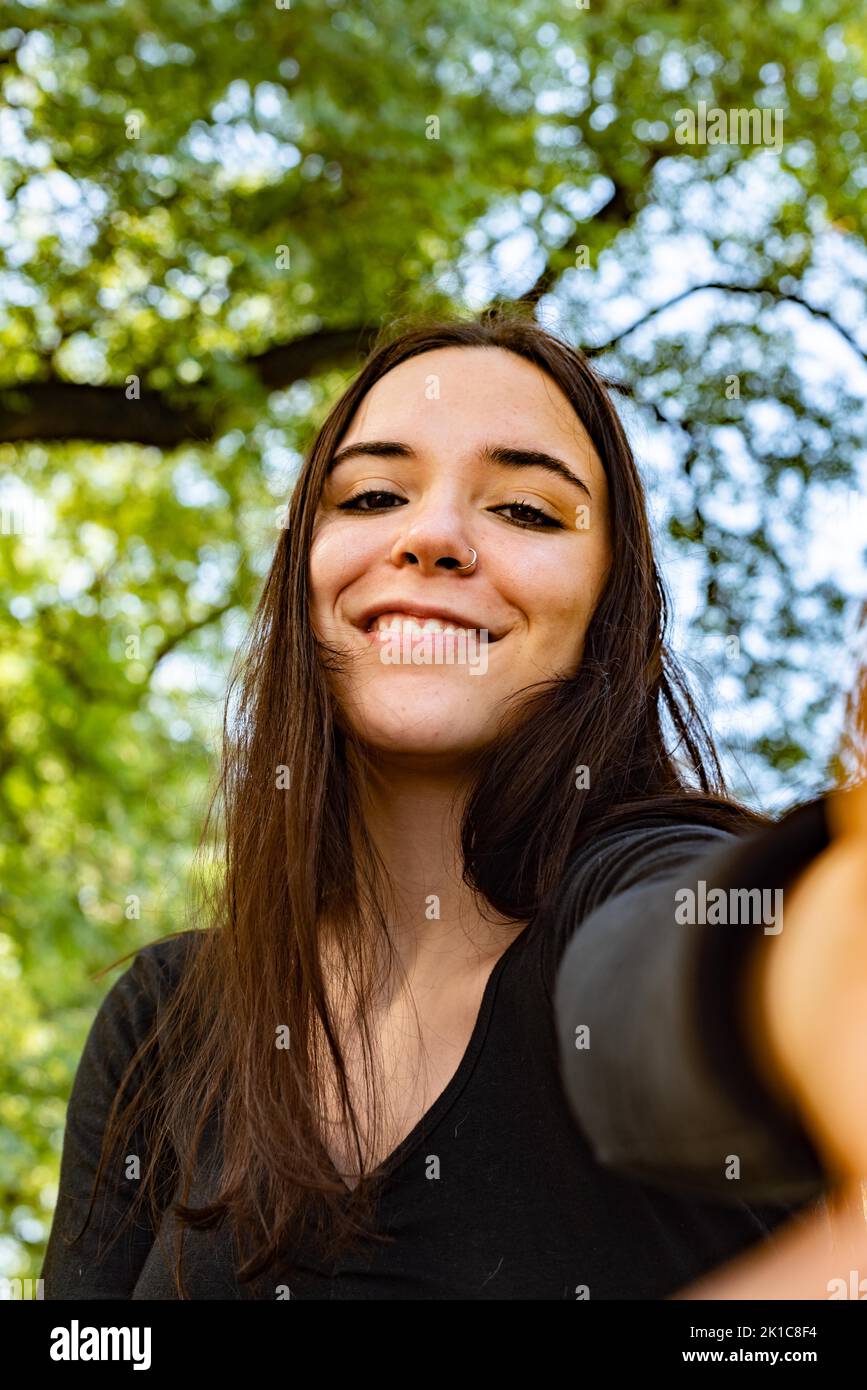 A beautiful girl making a selfie smiling in camera Stock Photo - Alamy