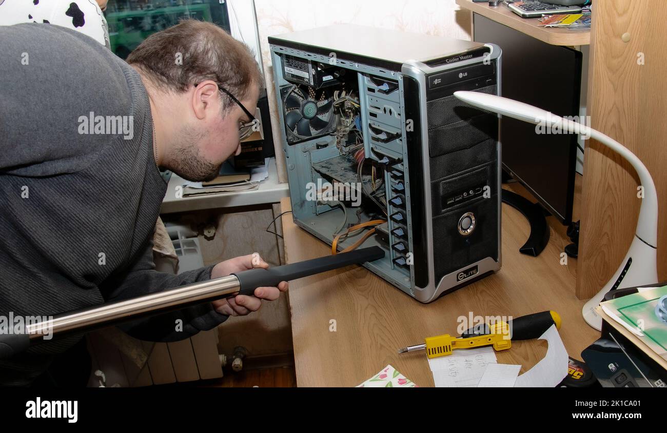 Dnepropetrovsk, Ukraine - 11.27.2021: The programmer cleans the desktop ...