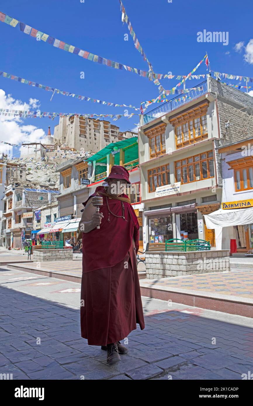 Ladakhi man with prayer wheel, Main Bazaar Road, Leh, Ladakh, India ...