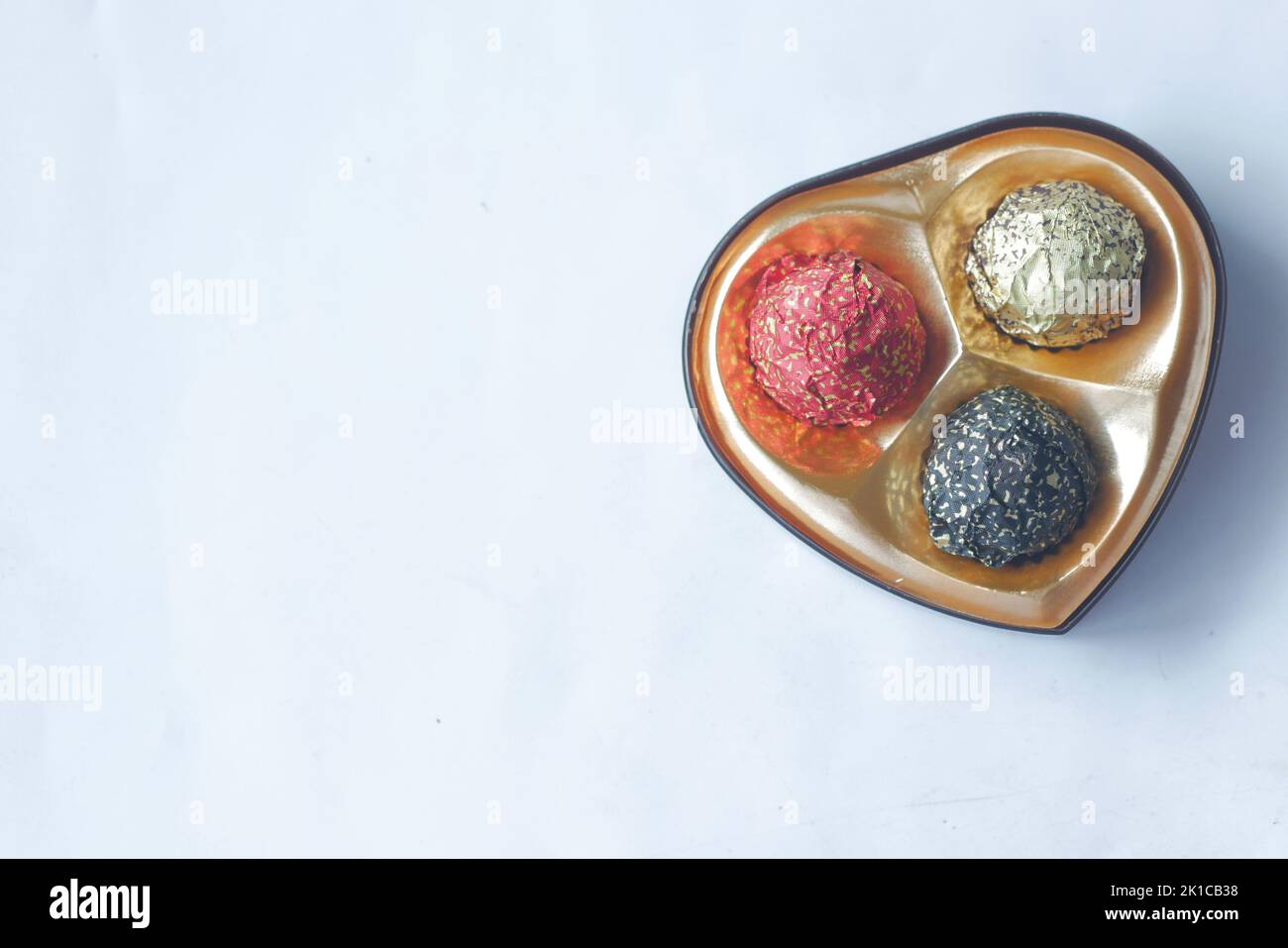 dark chocolate on a heart shape box on table Stock Photo - Alamy