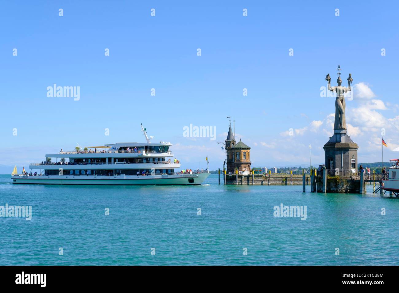 Excursion boat in front of the harbour entrance, sculpture Imperia ...