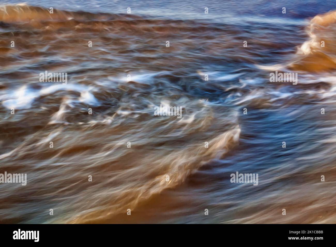 Waves on the beach, spray, agitated water in the evening light, dynamic ...