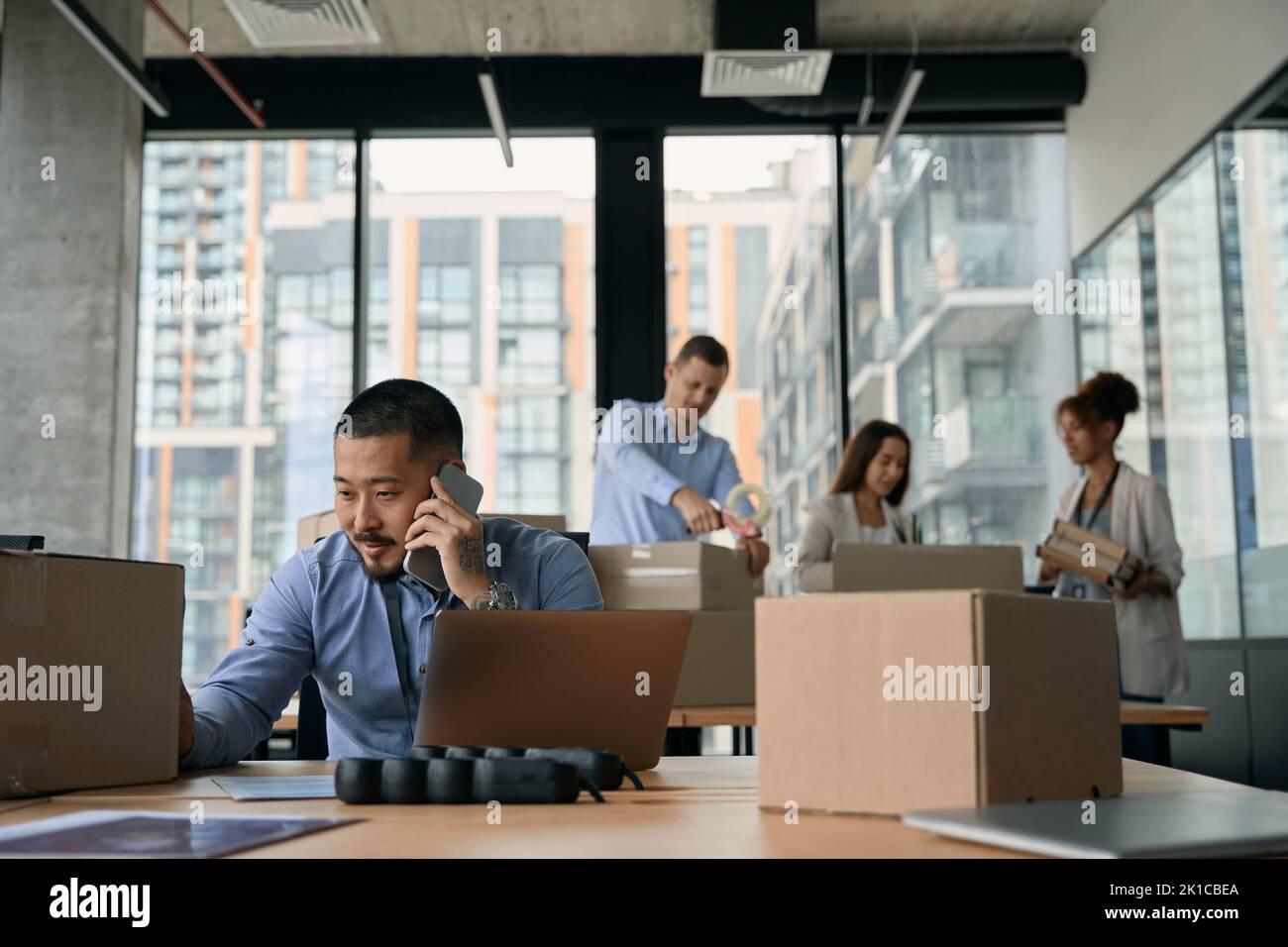 Group of company workers preparing for office relocation Stock Photo ...
