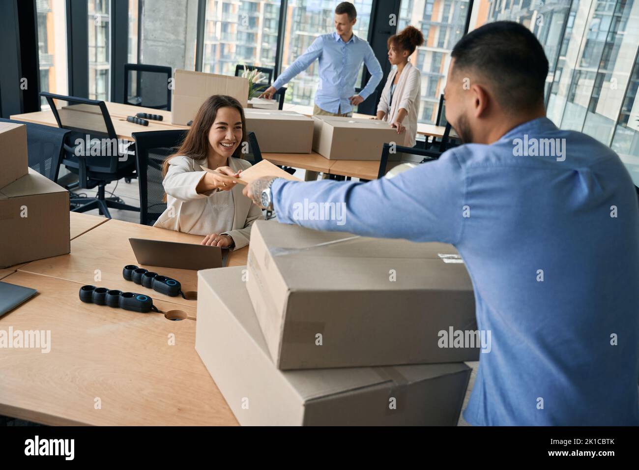 Group of corporate employees involved in office move Stock Photo - Alamy