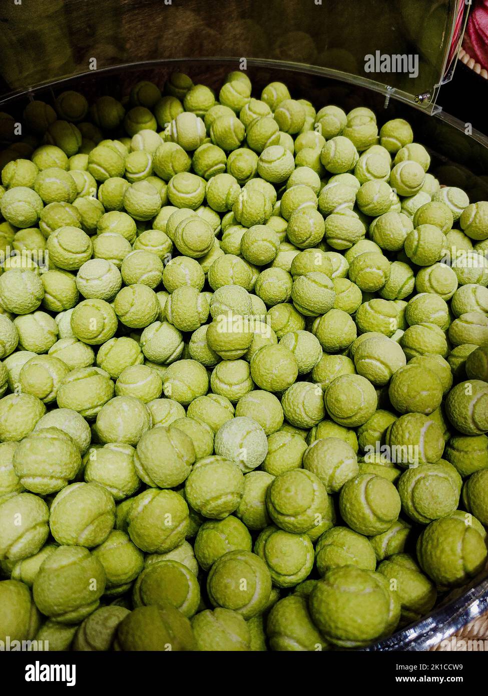 barrel full of jelly beans and chewing gum in the shape of tennis balls ...