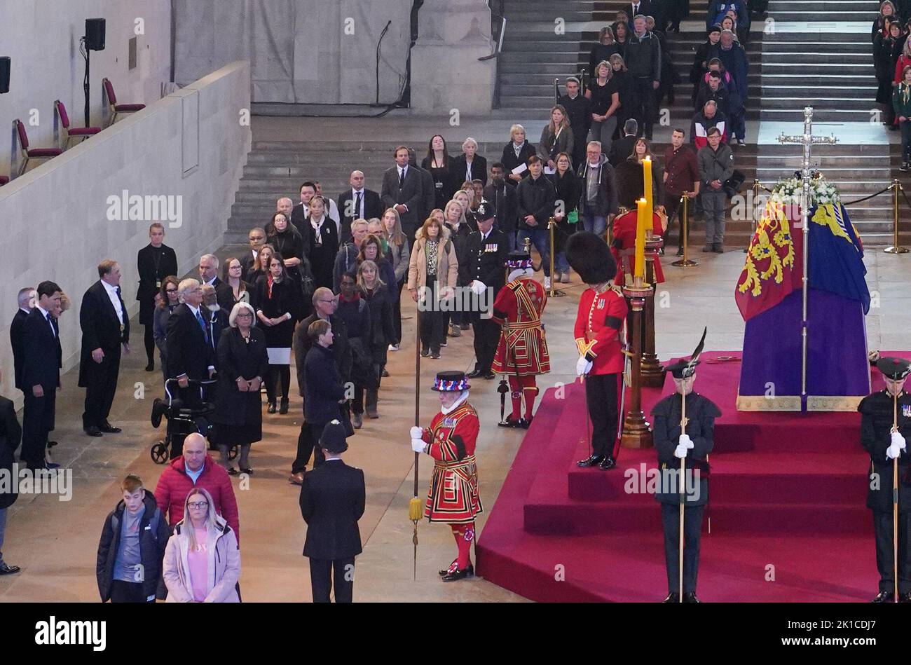 Prime Minister of Canada, Justin Trudeau (far left), bows his head in a ...