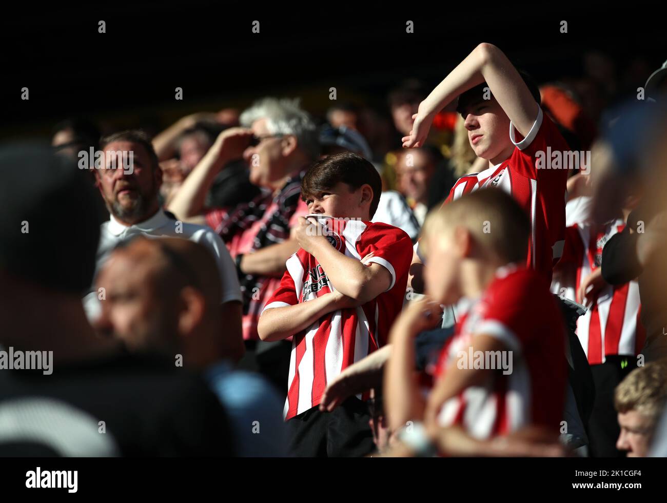 Sheffield united fans shield there eyes from the sun hi-res stock ...