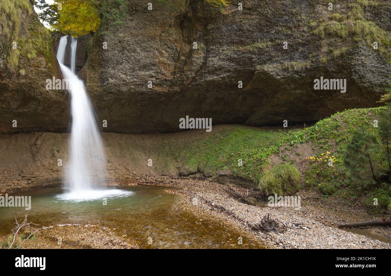 Beautiful perspective of a silky flowing waterfall in a valley in ...