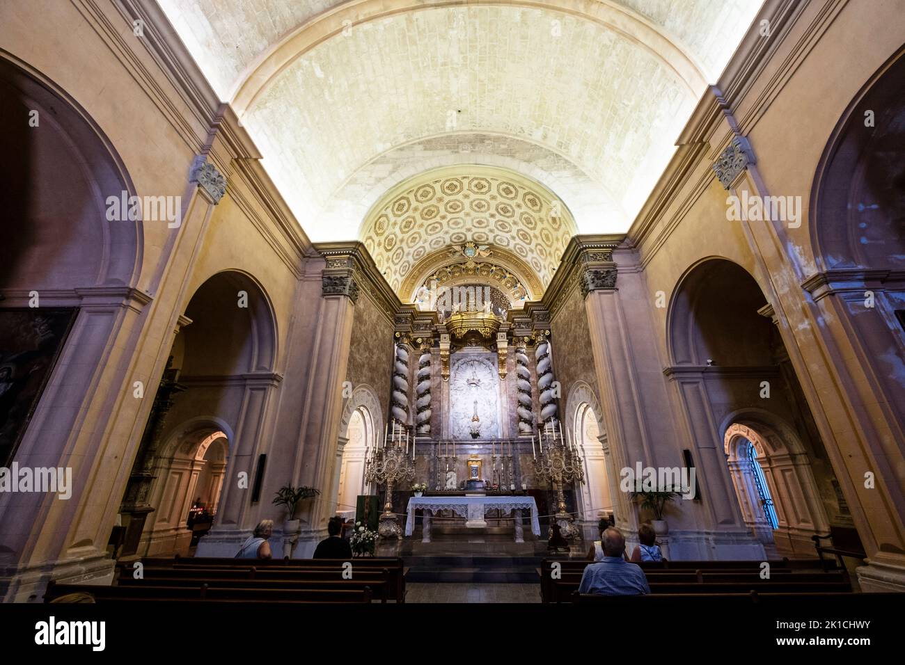 Gothic altarpiece and colorful paintings of religious imagery ...