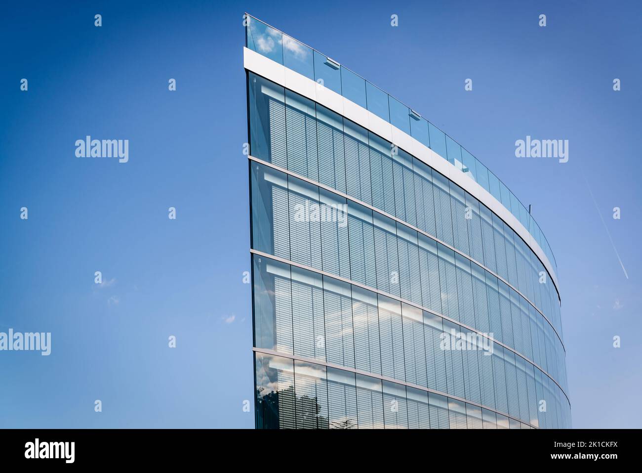 Modern glass office building with plain blue sky background, Geneva ...