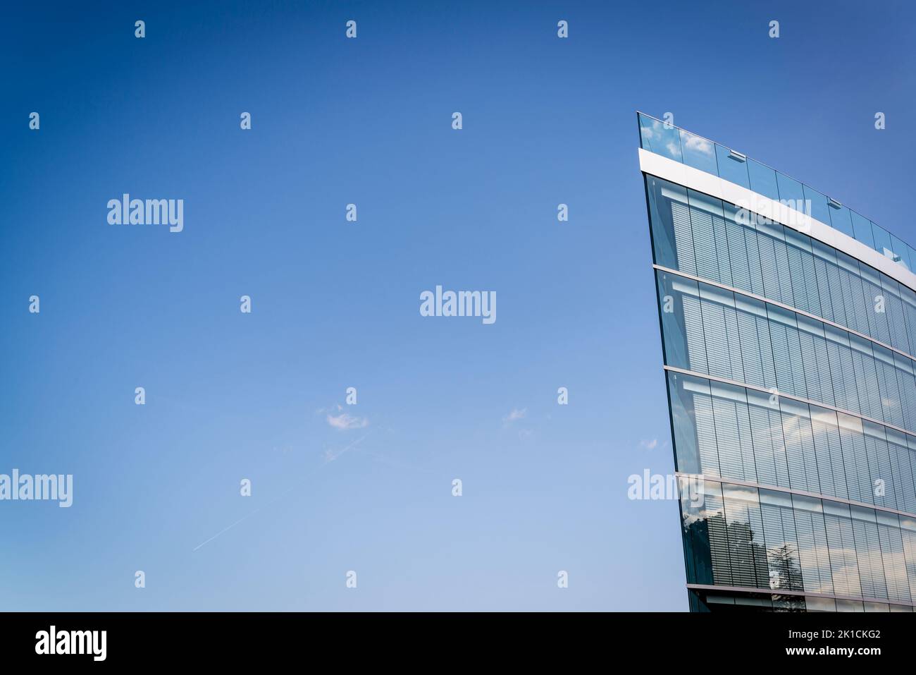 Modern glass office building with plain blue sky background, Geneva ...