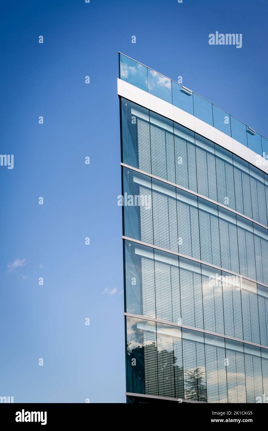 Modern glass office building with plain blue sky background, Geneva ...