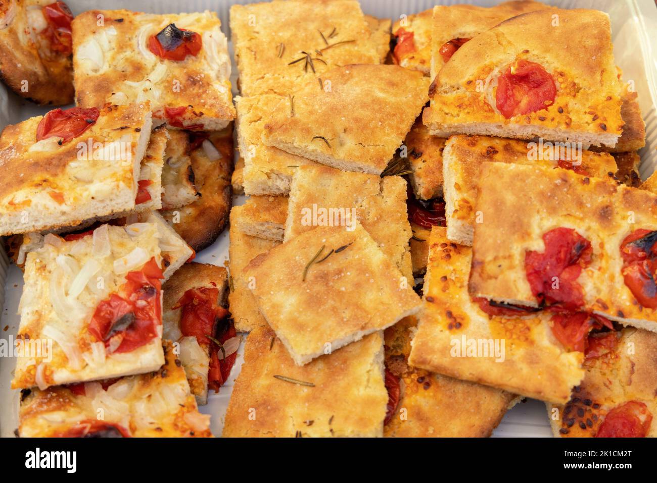 Freshly baked homemade apulian focaccia cut in slices top view. Barese ...