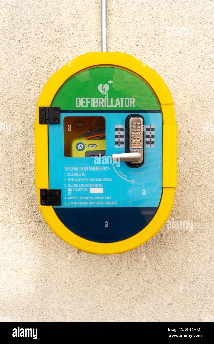 Life saving, portable automated defibrilator (AED) mounted on the wall ...