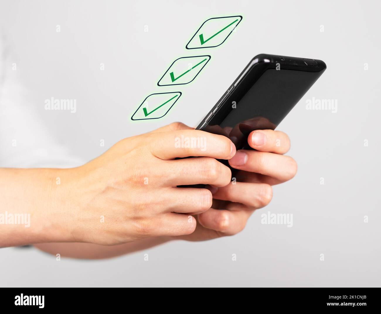 Hands holding phone for online survey, test taking. Questionnaire, quiz ...