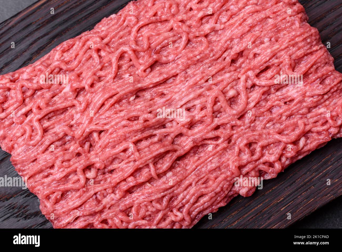 Raw mince beef, ground meat on a black background. Copy space Stock ...