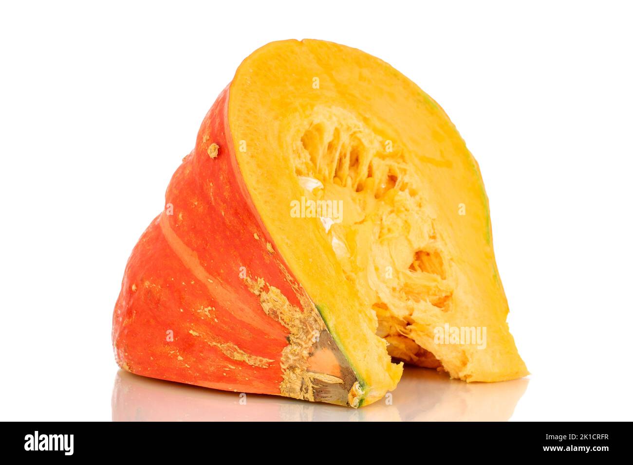 One part of ripe organic pumpkin, macro, isolated on white background ...