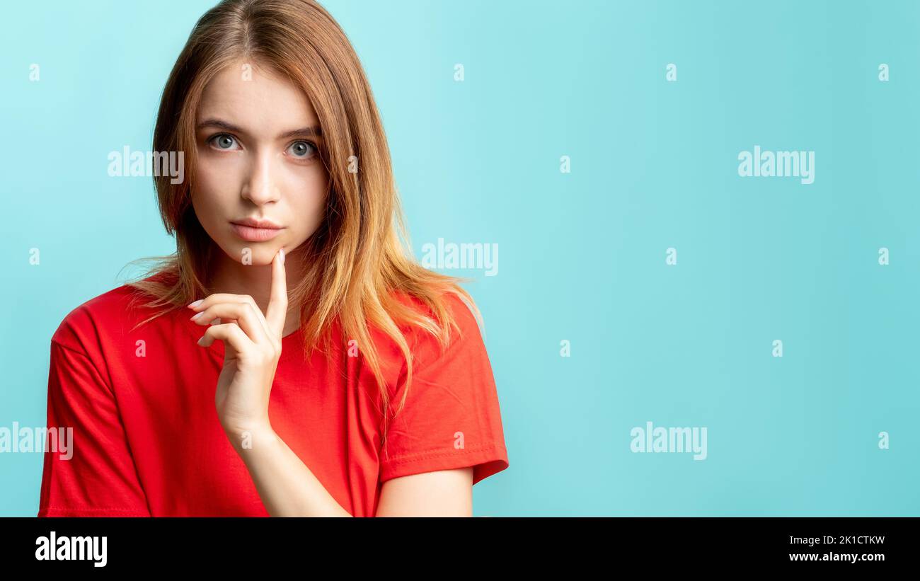 Curious woman. Problem solution. Portrait of doubtful lady in red t ...