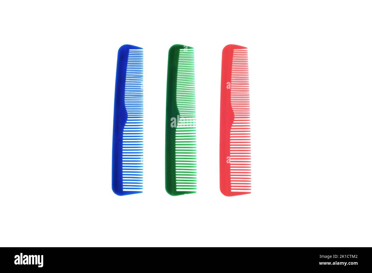 Combs on a white background Stock Photo - Alamy