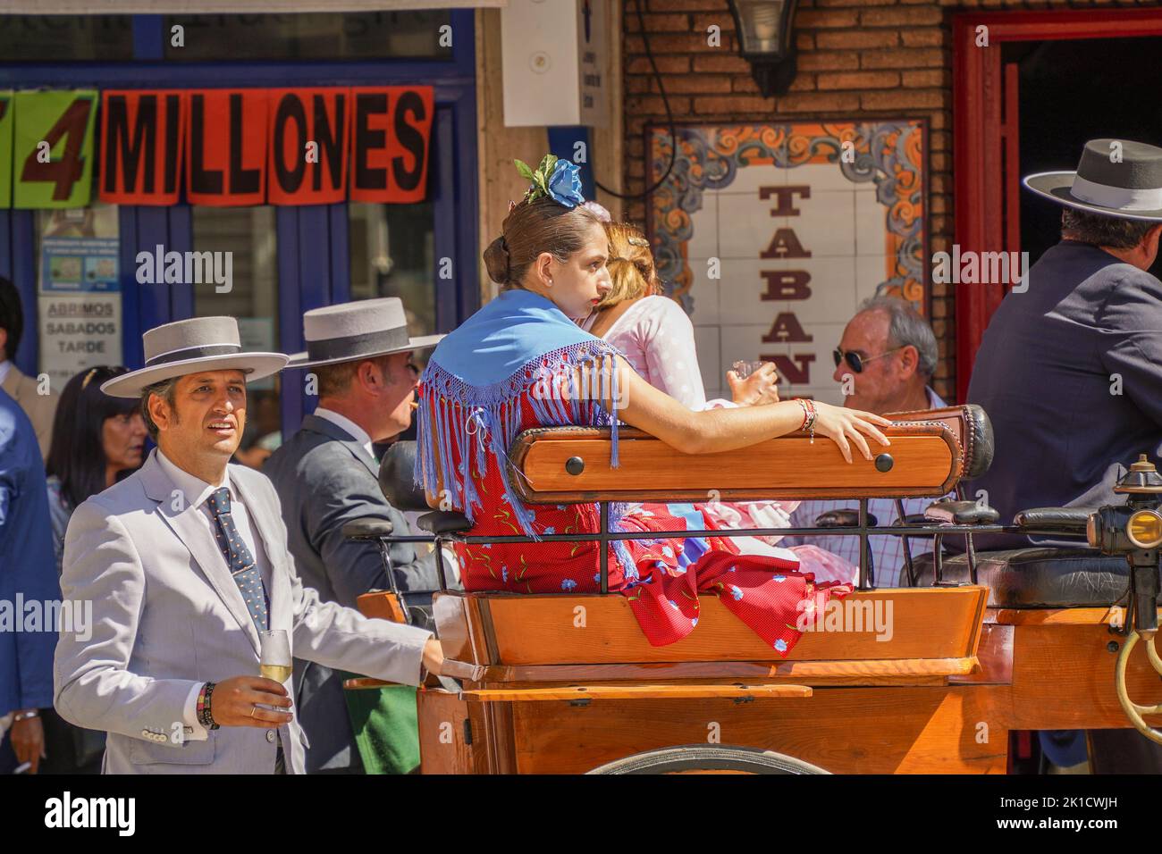 Spanish people dressed traditional decorated horse carriage, during ...