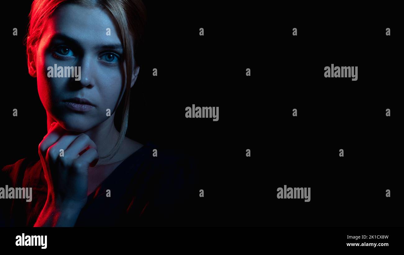 Female silhouette. Neon light portrait. Melancholic woman in red glow ...