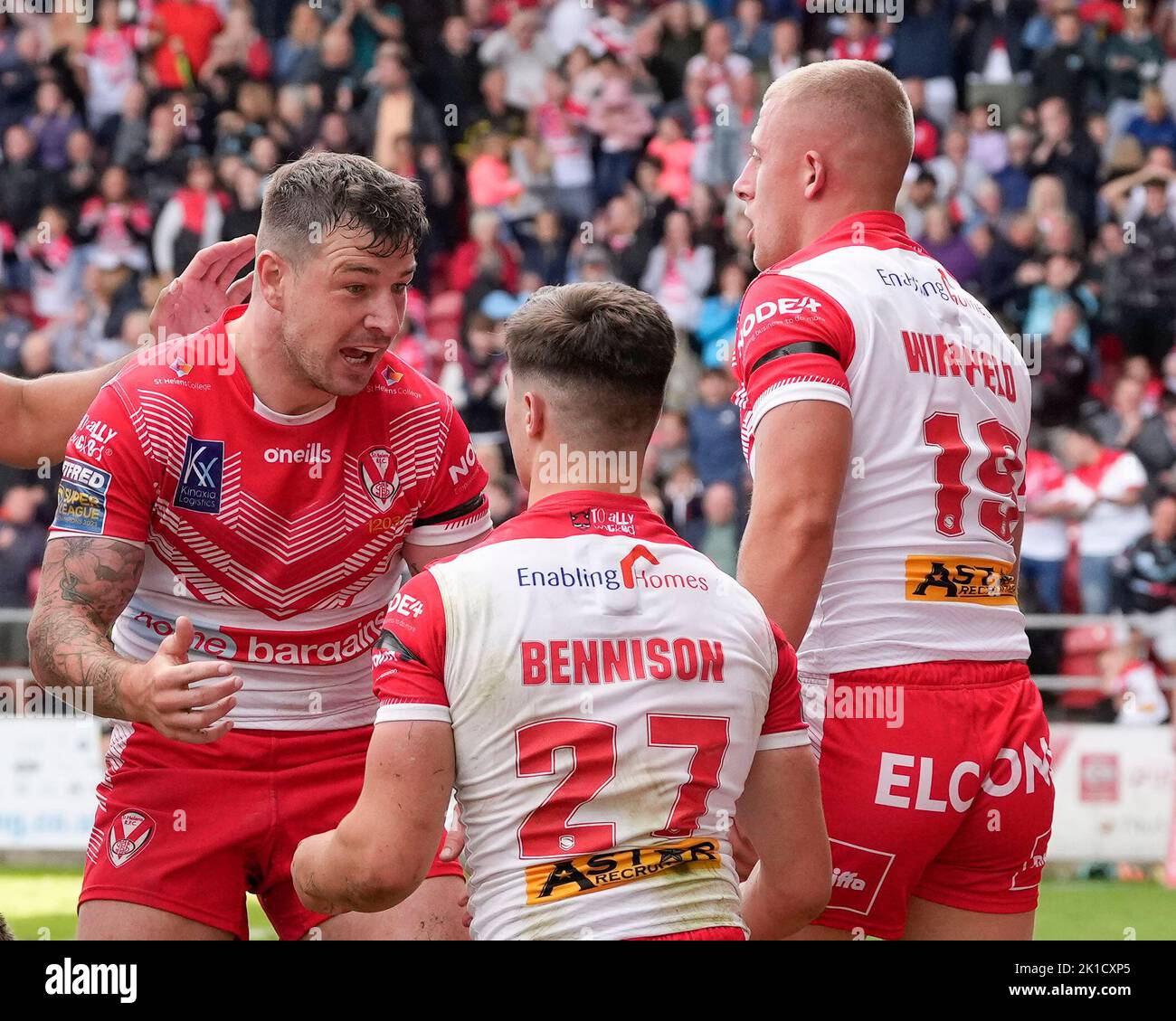 Mark Percival #4 celebrates with try scorer Joe Bennison #27 of St ...