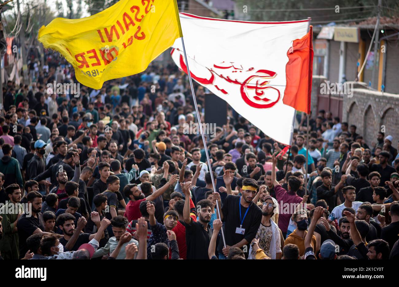 Srinagar, India. 17th Sep, 2022. Shia Muslims wave religious flags as ...