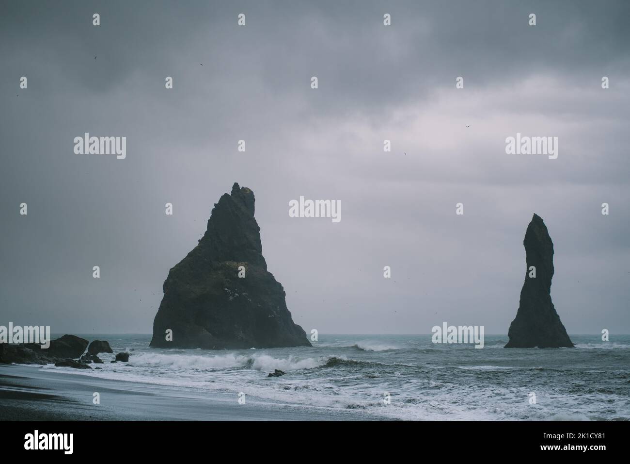 A scenic shot of the Reynisdrangar near a beach in Iceland under a ...
