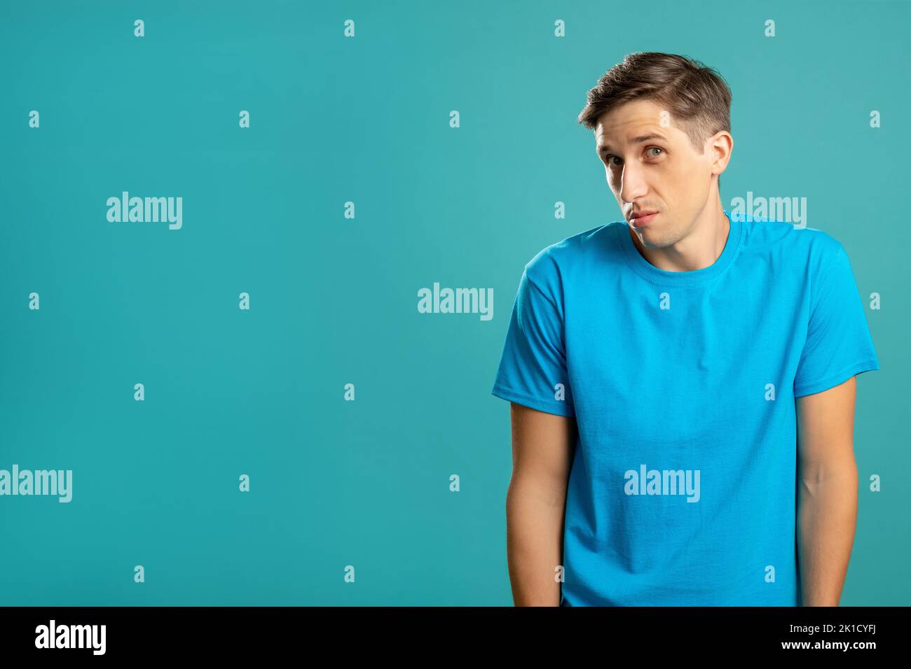 Doubtful male portrait. Regret mistake. Disengage emotion. Unsure look ...