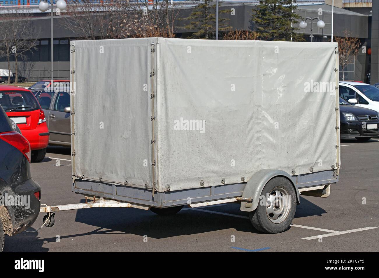Single axel cargo trailer with pvc cover transport Stock Photo - Alamy