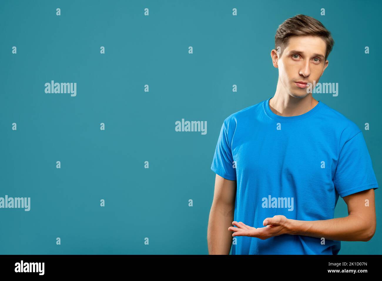 Confused man. Welcome gesture. Information banner. Young guy holding ...