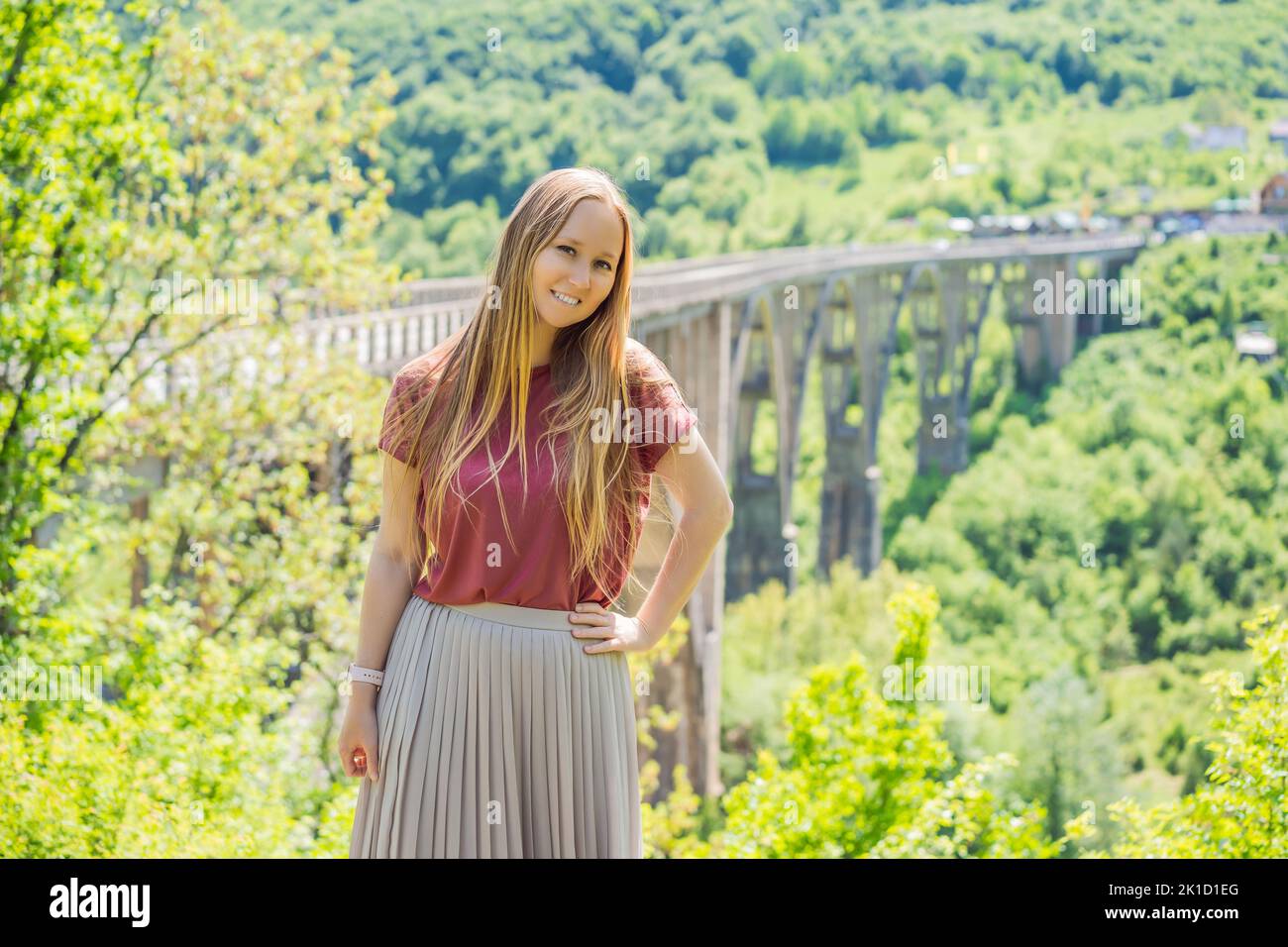 Montenegro. Woman tourist in background of Dzhurdzhevich Bridge Over ...