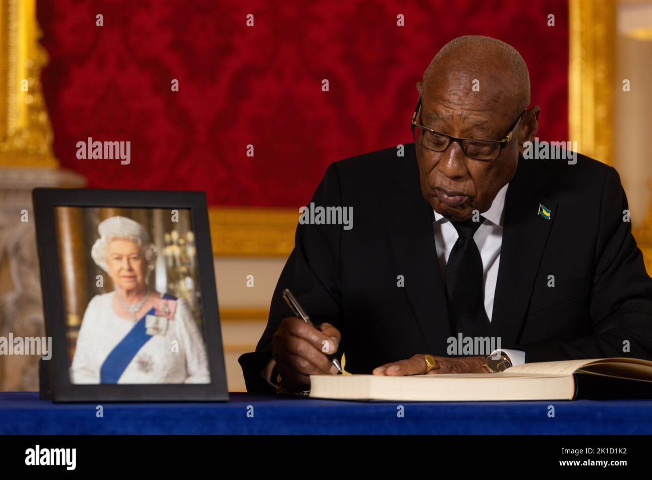 Governor-General of Bahamas, Cornelius A.Smith, signs a book of ...