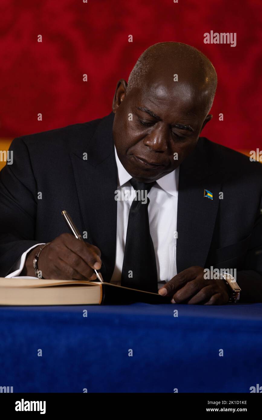 Prime Minister of Bahamas, Philip "Brave" Davis, signs a book of ...