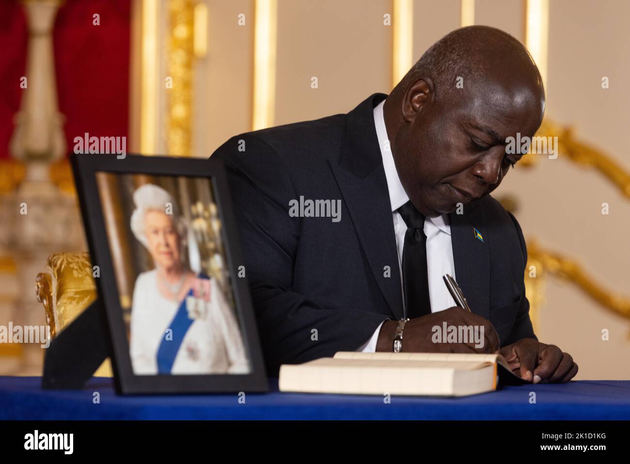 Prime Minister of Bahamas, Philip "Brave" Davis, signs a book of ...