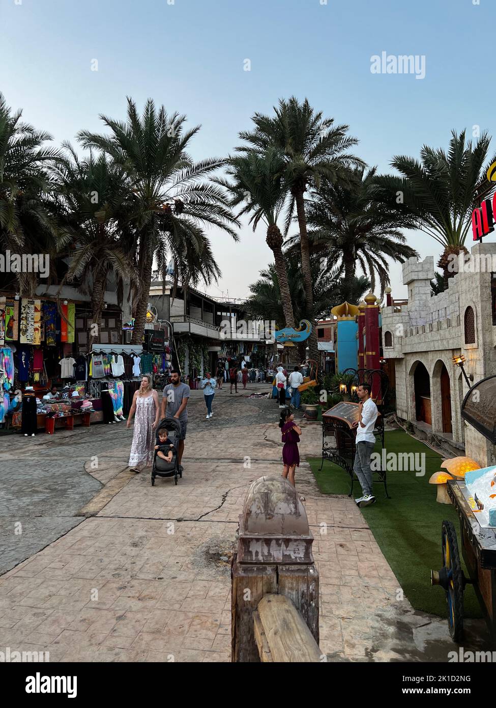 A vertical shot of a street with shops and people in Dahab, Egypt Stock ...