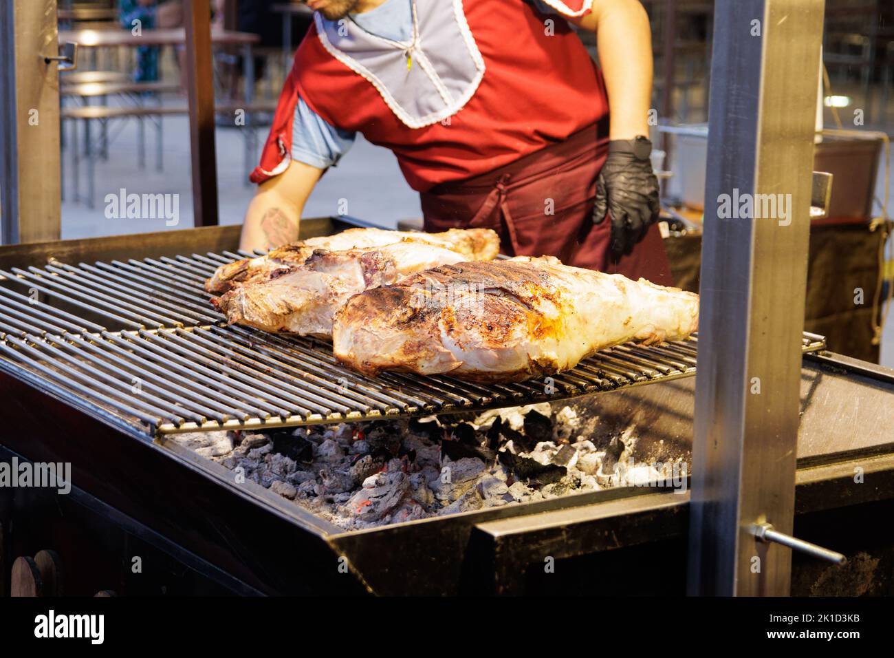 Grilled pork in a medieval market Stock Photo - Alamy