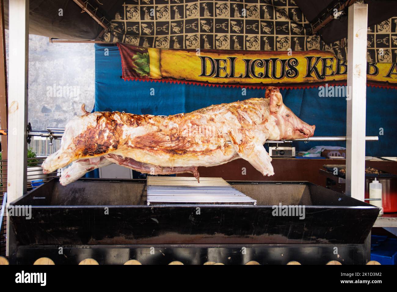 Grilled pork in a medieval market Stock Photo - Alamy